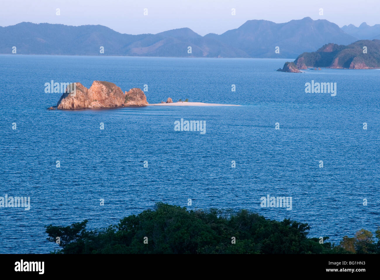 An uninhabited small isle with a long sandy beach in Maricaban Bay in ...