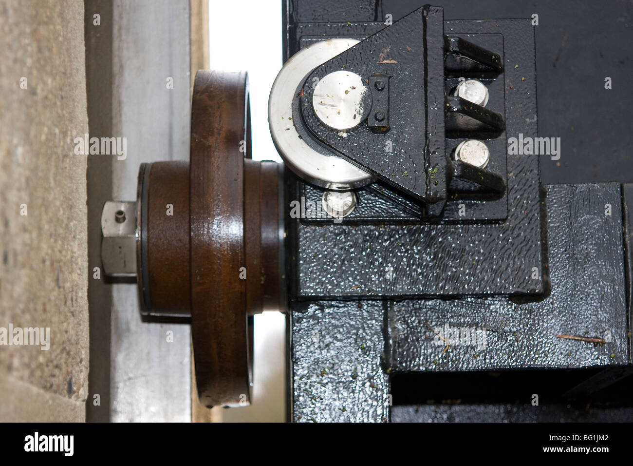 new sluice gate metal engineering winch rollers Stock Photo - Alamy