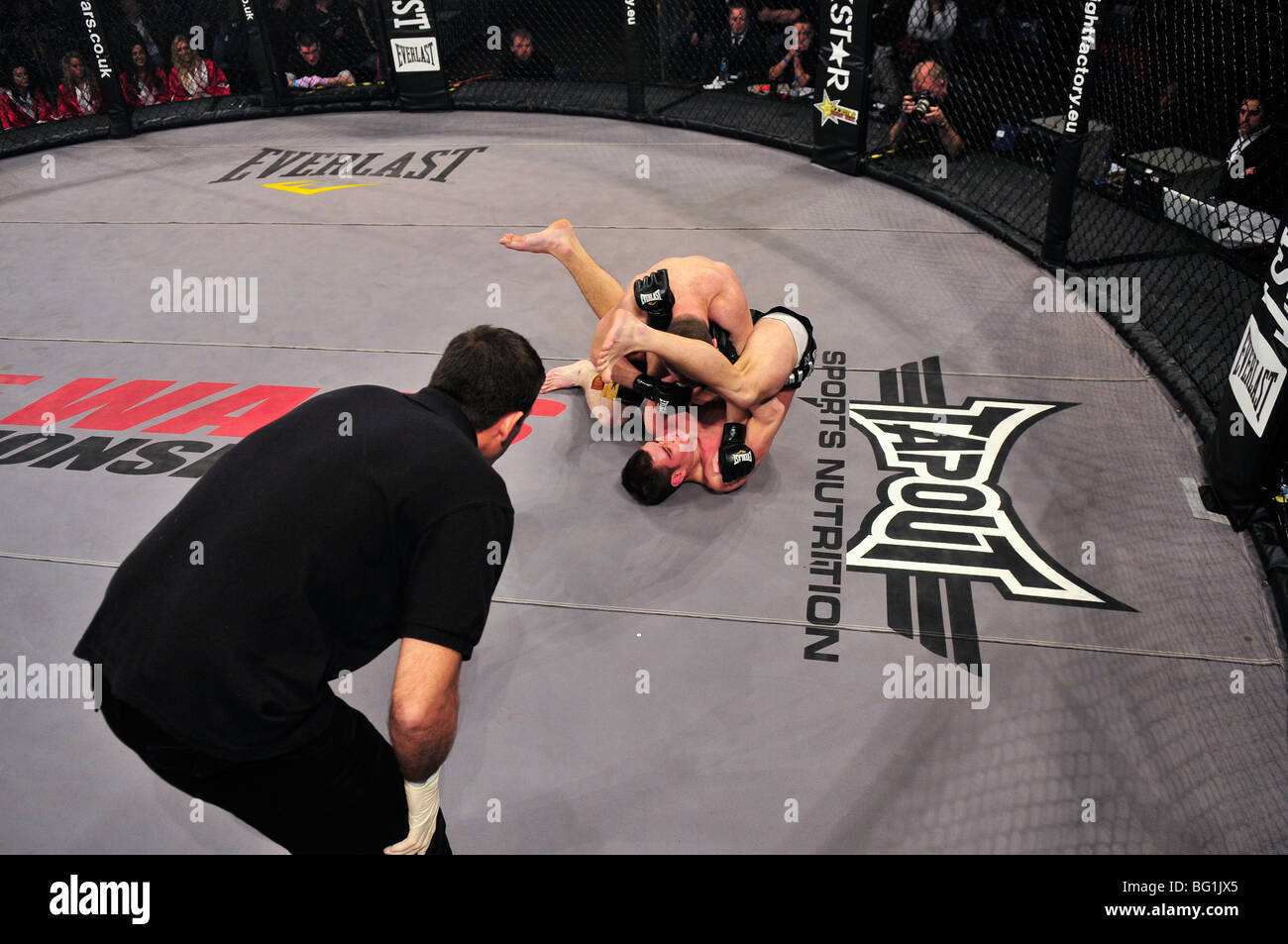 Two cage fighters in the ring during "Cage Wars - Nightmare", Kings ...