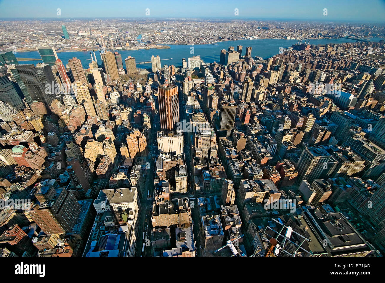 East River seen from top of Empire State Building with shadow of Empire ...