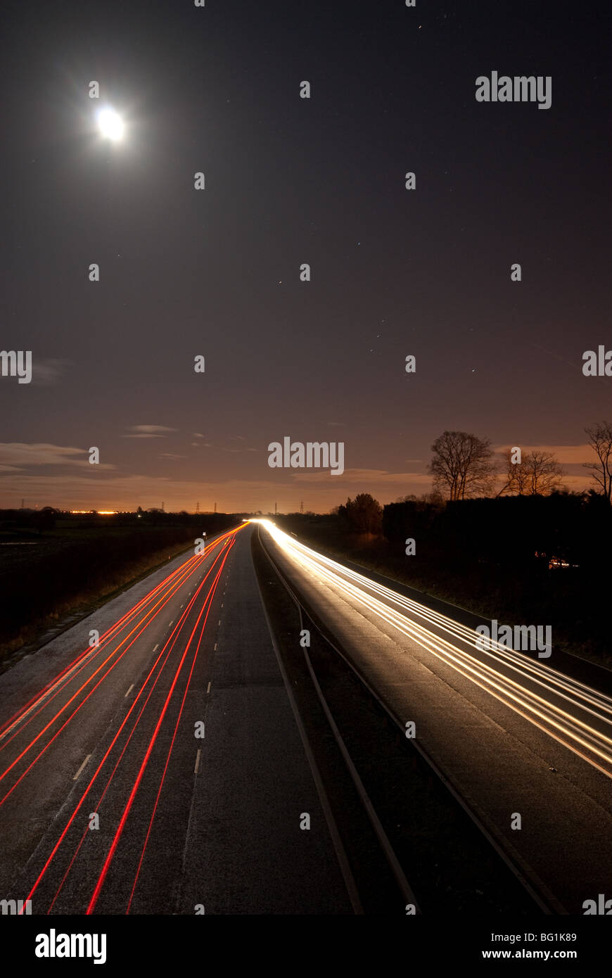 M55 Motorway at Night with traffic trails and moonlit sky Stock Photo ...