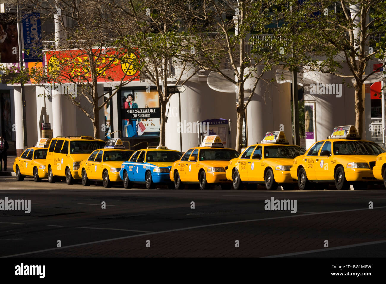 Taxis in a line up on Figueroa, downtown, Los Angeles, California ...