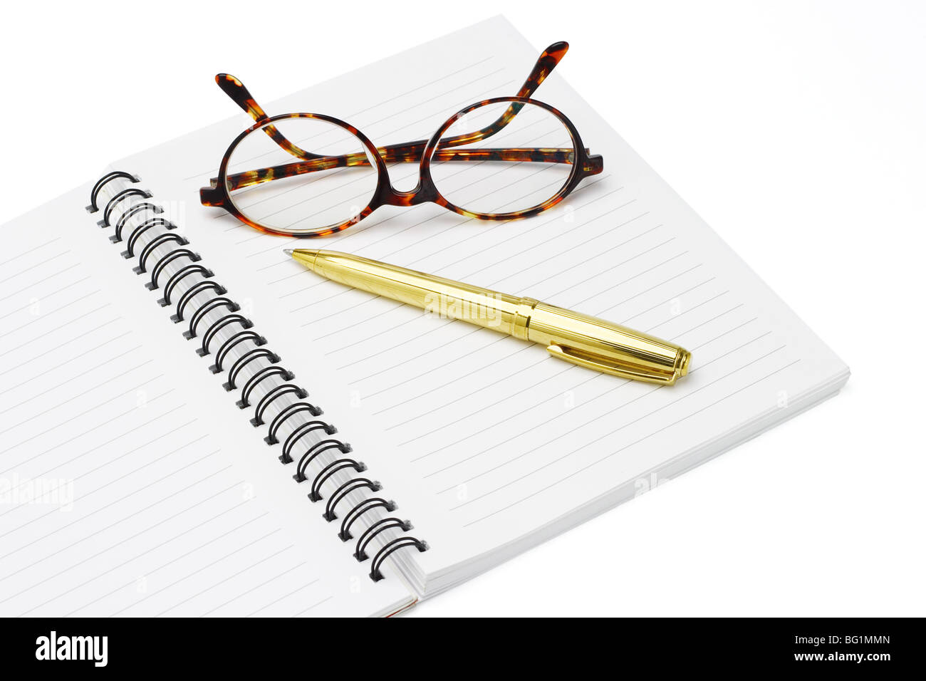Pen and eyeglasses on a notebook on white background Stock Photo - Alamy