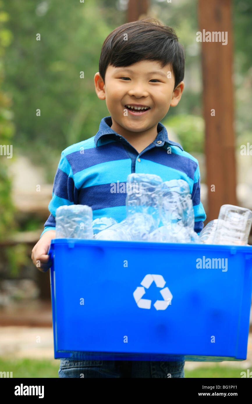 Carrying recycling bin hi-res stock photography and images - Alamy