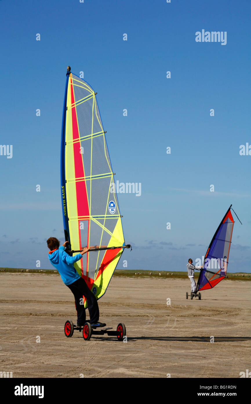 People windskating at Lakolk beach in Romo, Jutland, Denmark ...