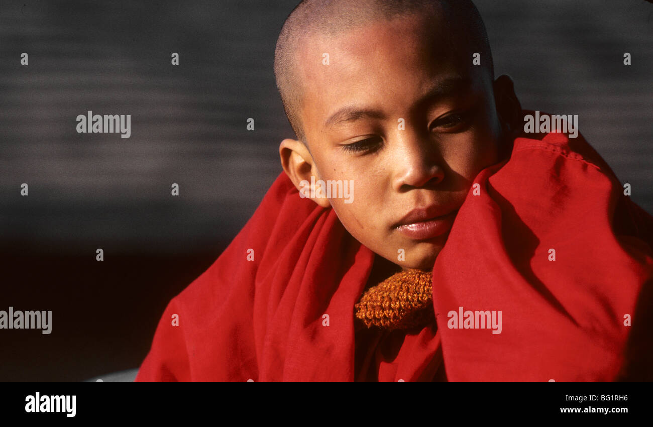 A portrait of a young Buddhist monk, Menghai, Yunnan Province, China ...