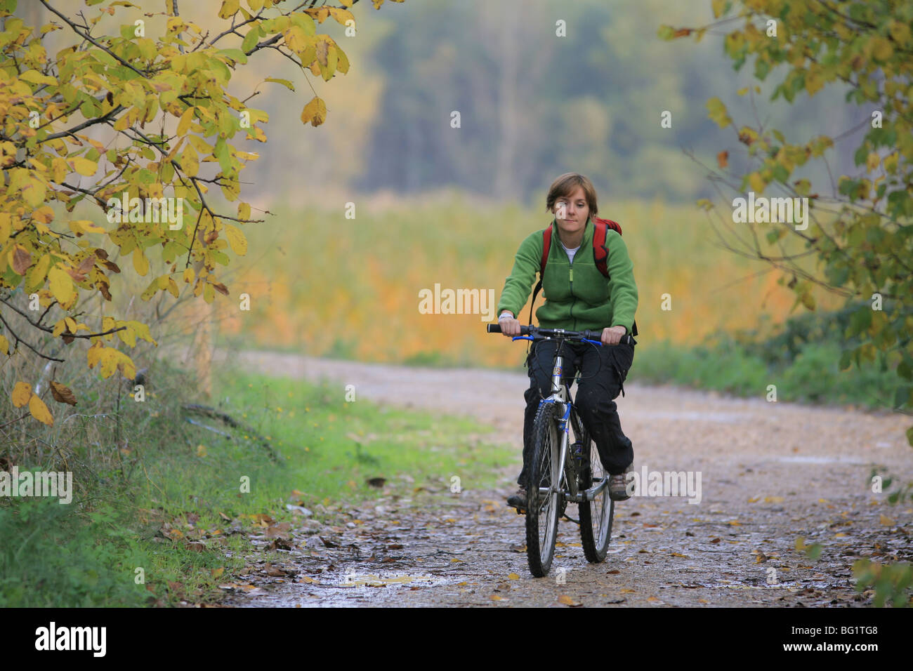 girl cycling on nature, autumn season Stock Photo - Alamy