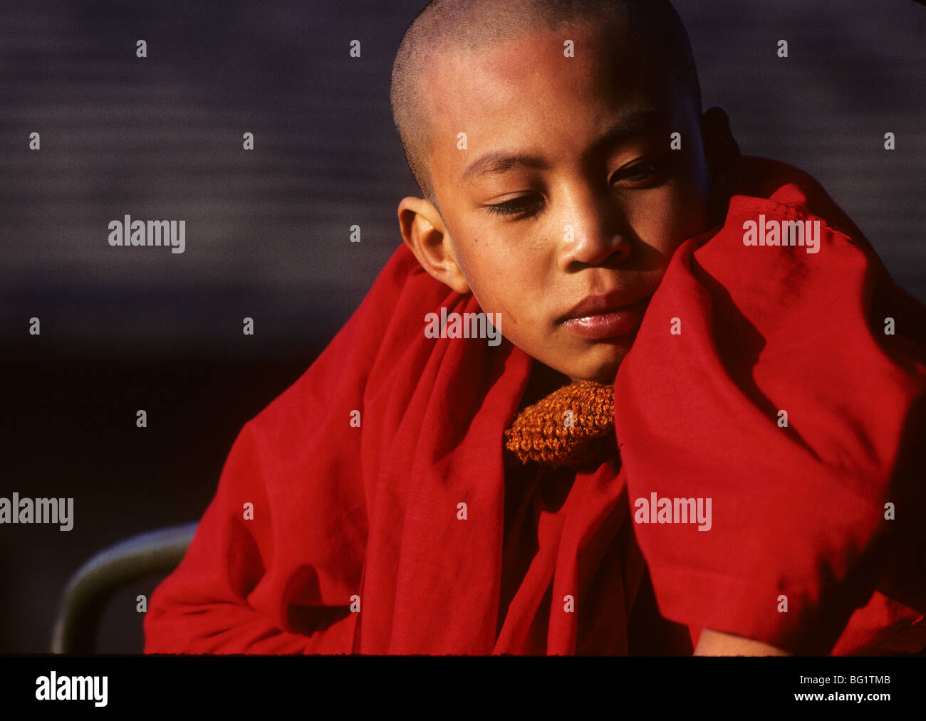 A portrait of a young Buddhist monk, Menghai, Yunnan Province, China ...