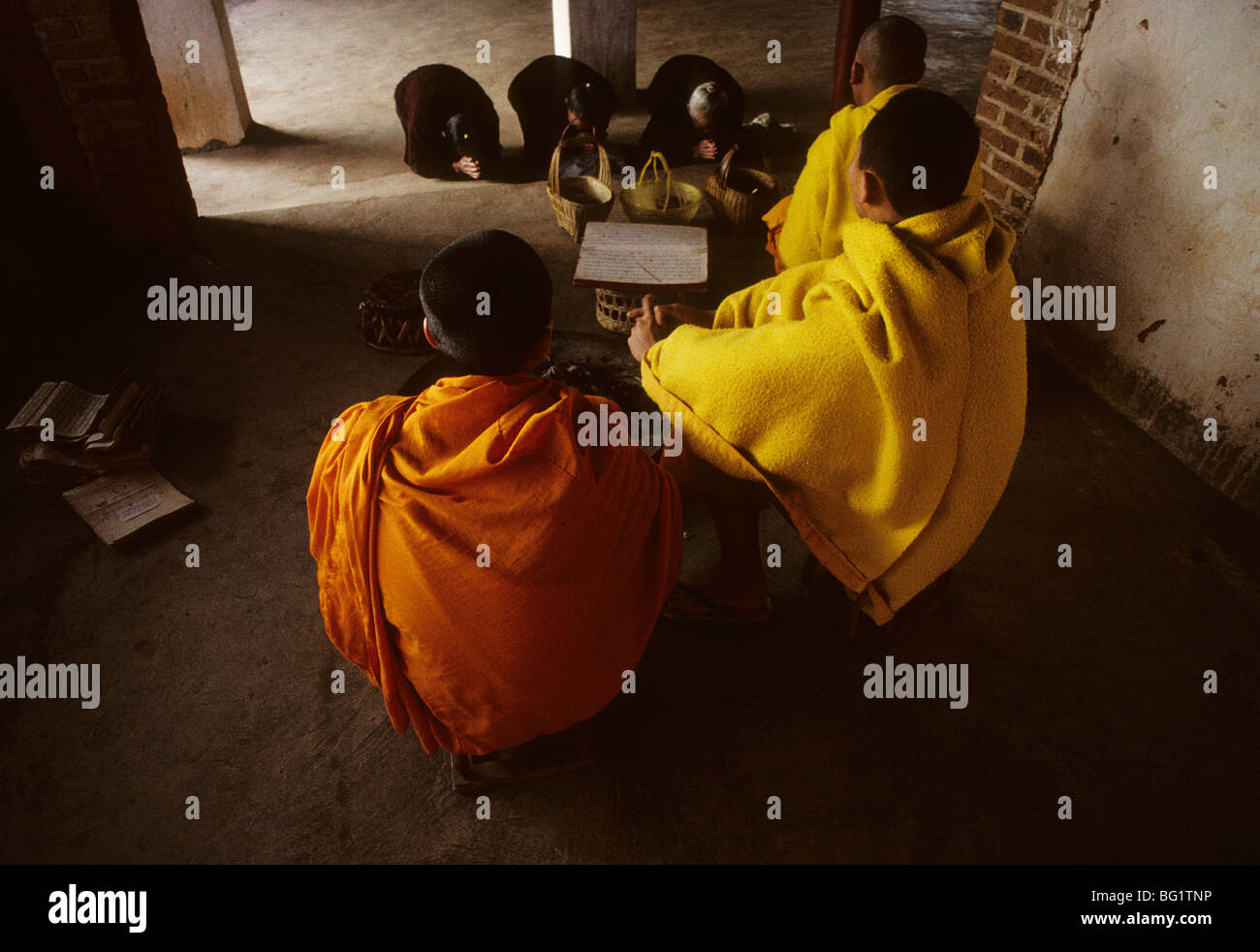Women bow to Buddhist monks in Menghai, Yunnan Province, China Stock ...