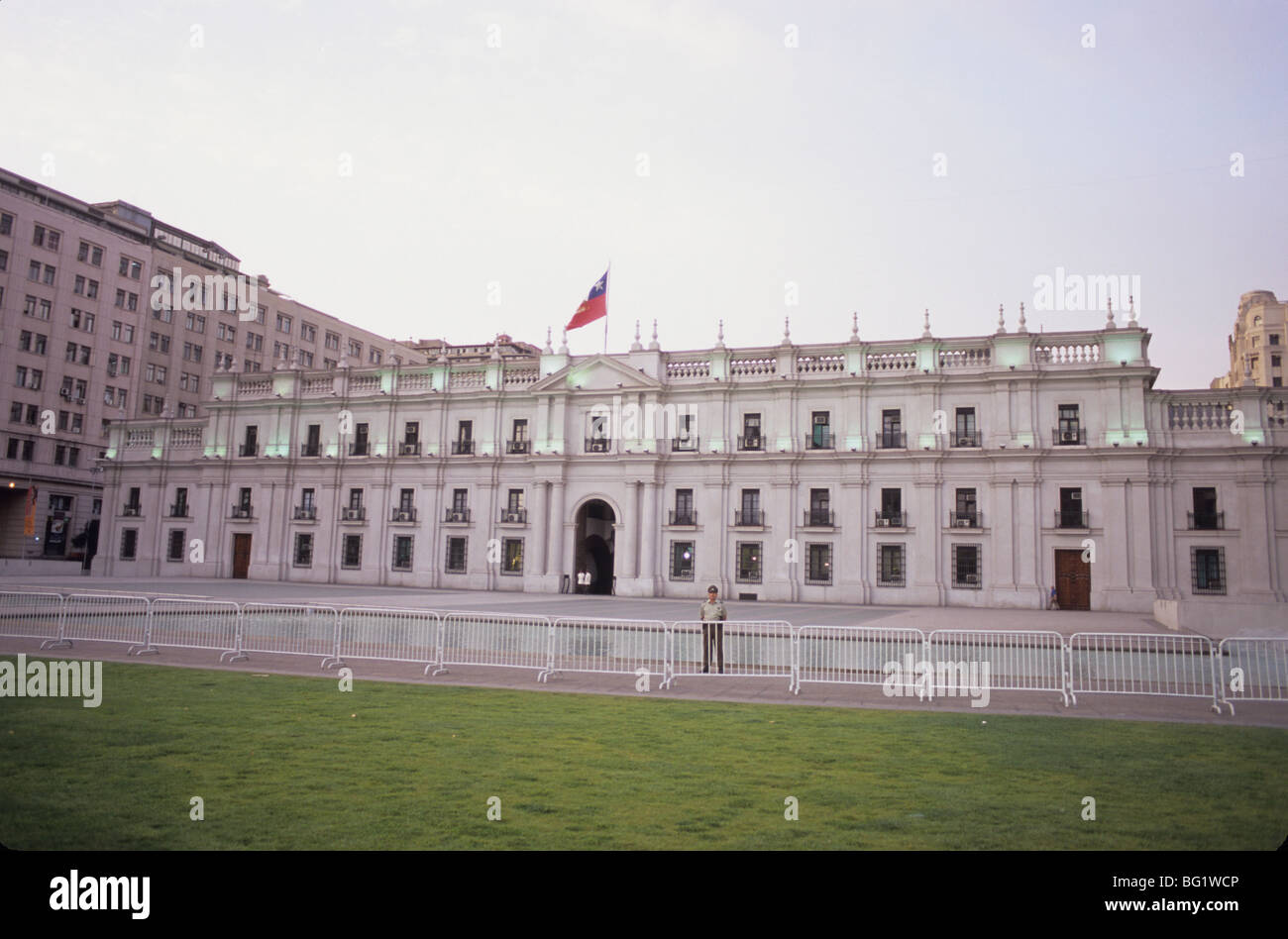 Guard stands in front of La Moneda, the current seat of the President ...
