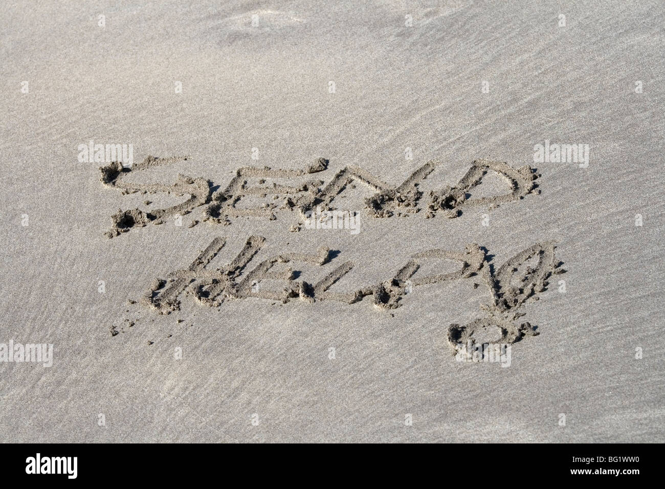 Send Help. Message written on a beach in the sand Stock Photo - Alamy
