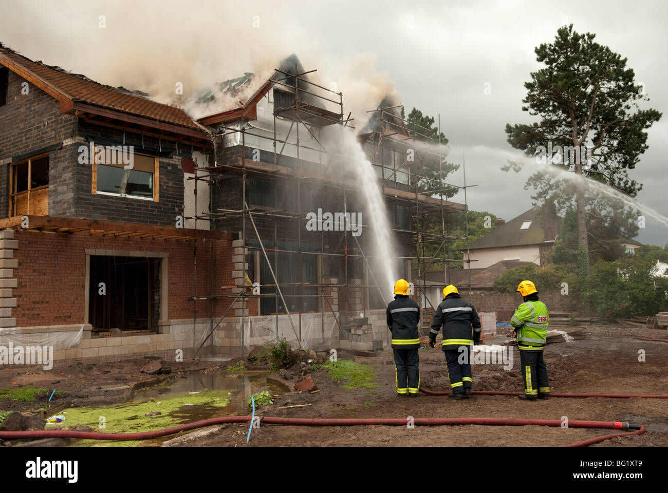 Detached house under renovation on fire Stock Photo - Alamy