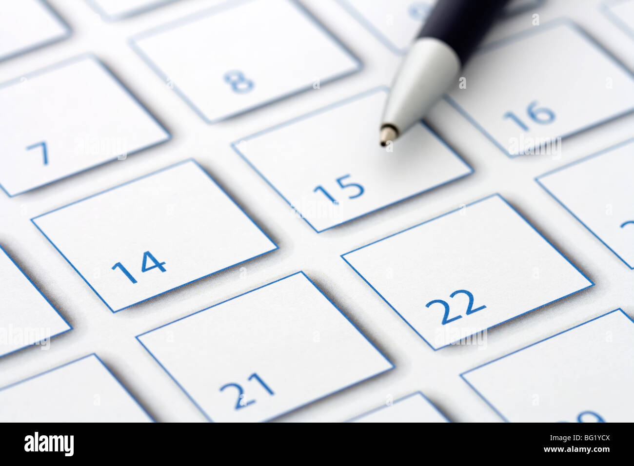 Blue Pen on blue calendar Stock Photo - Alamy