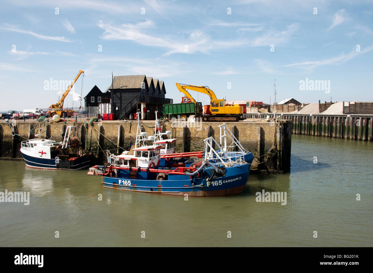 A view of Whitstable harbor with some fishing boats Stock Photo - Alamy