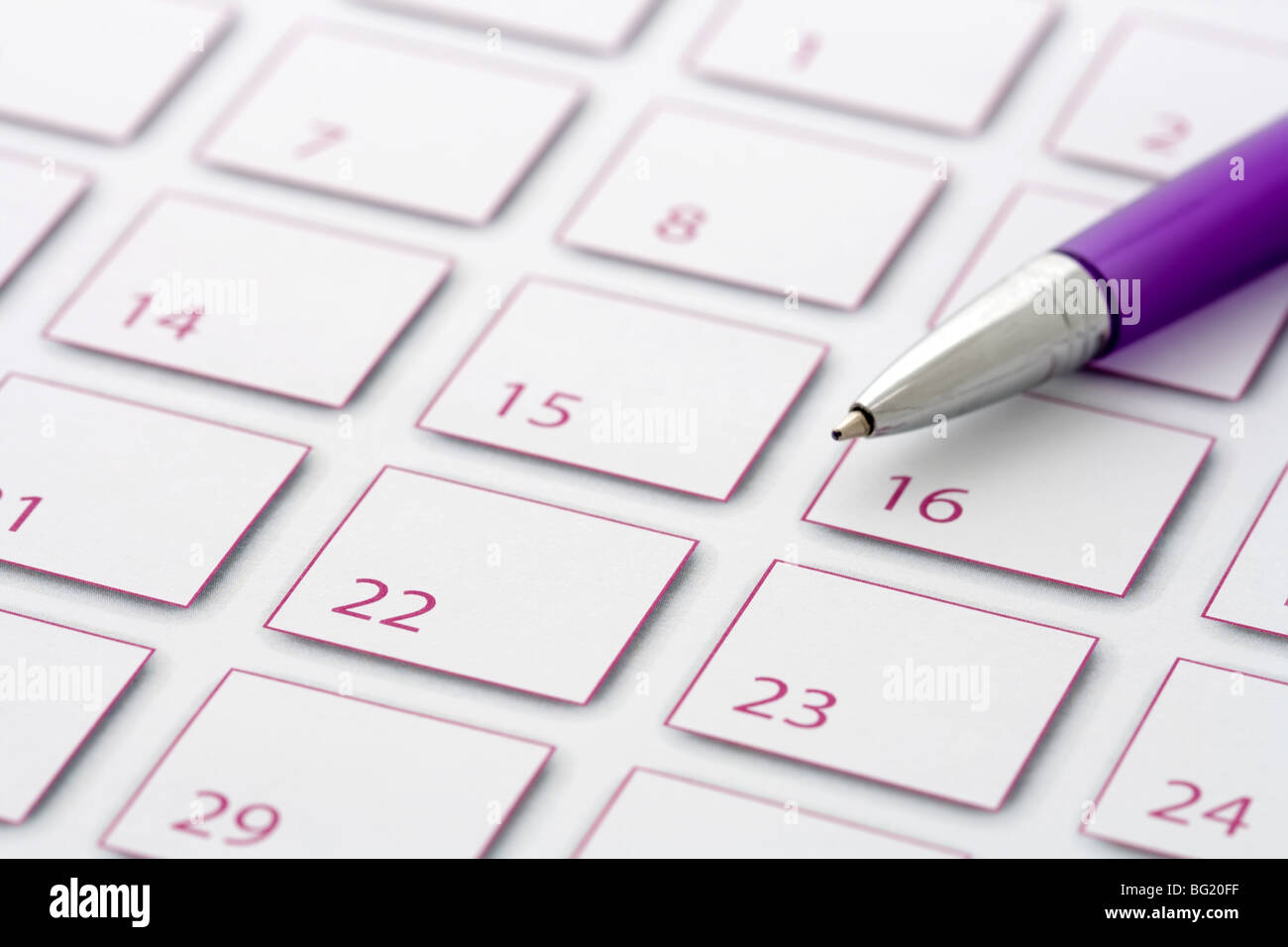 Purple Pen on purple calendar Stock Photo - Alamy