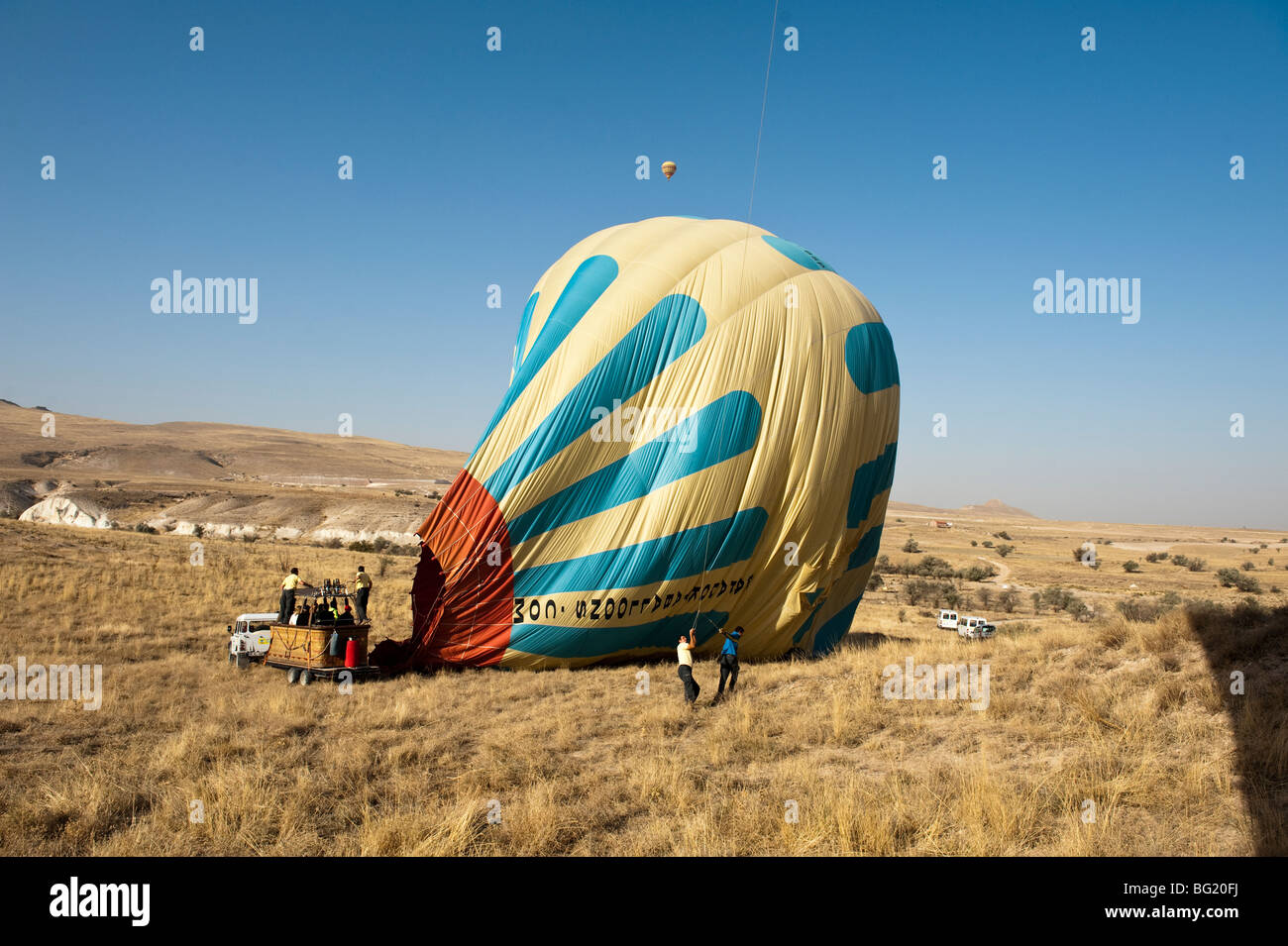 Hot air balloon envelope being collapsed after a flight in Cappadocia ...