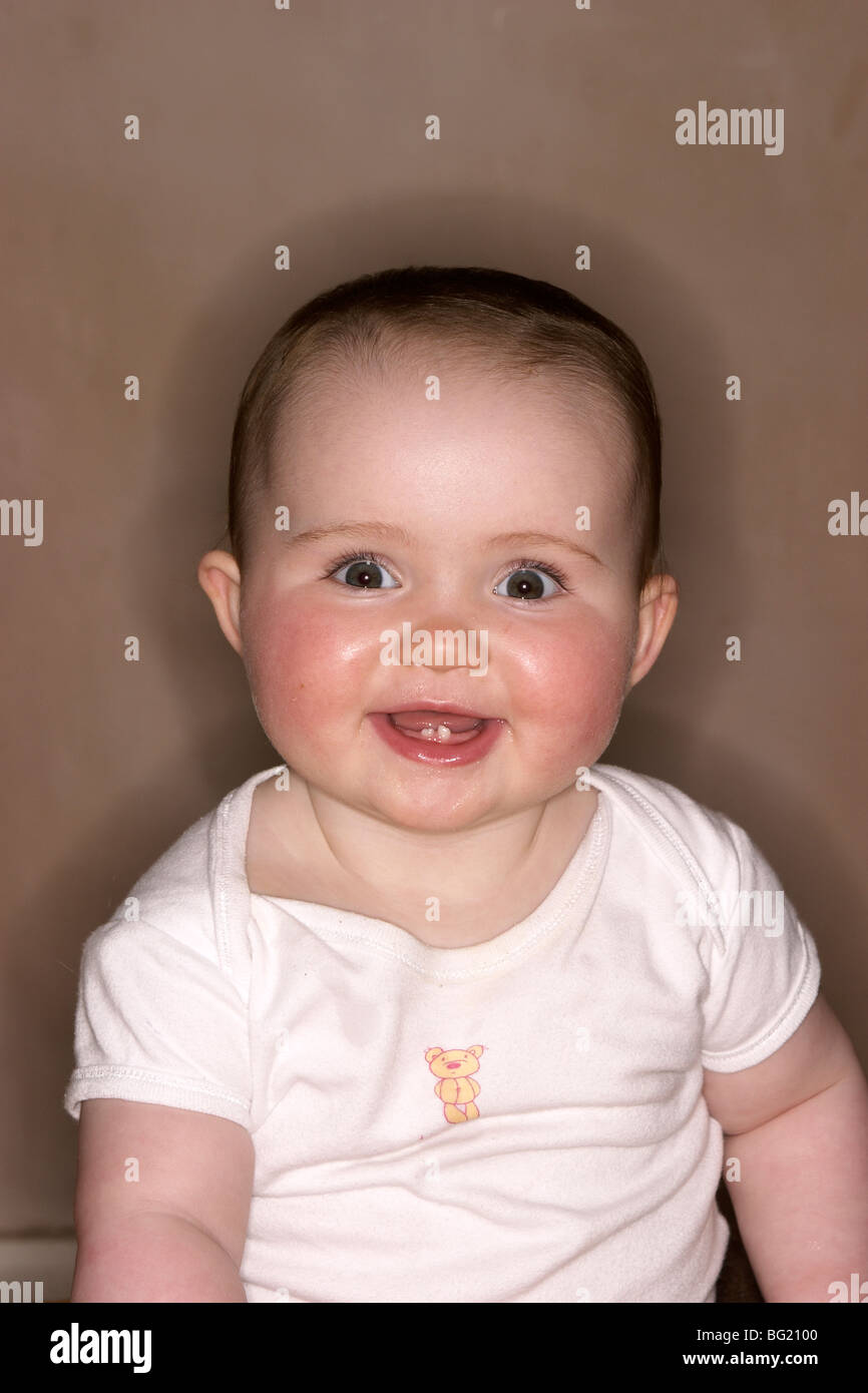 Happy Baby with two new baby teath teeth Stock Photo - Alamy