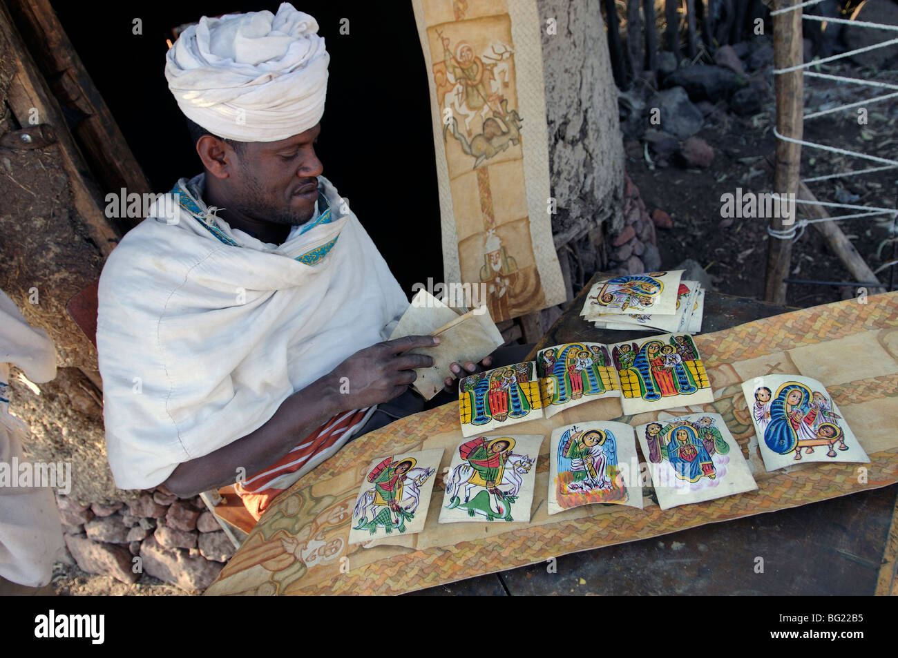 man hand-painting postcards at churches, Lalibela, Ethiopia Stock Photo ...