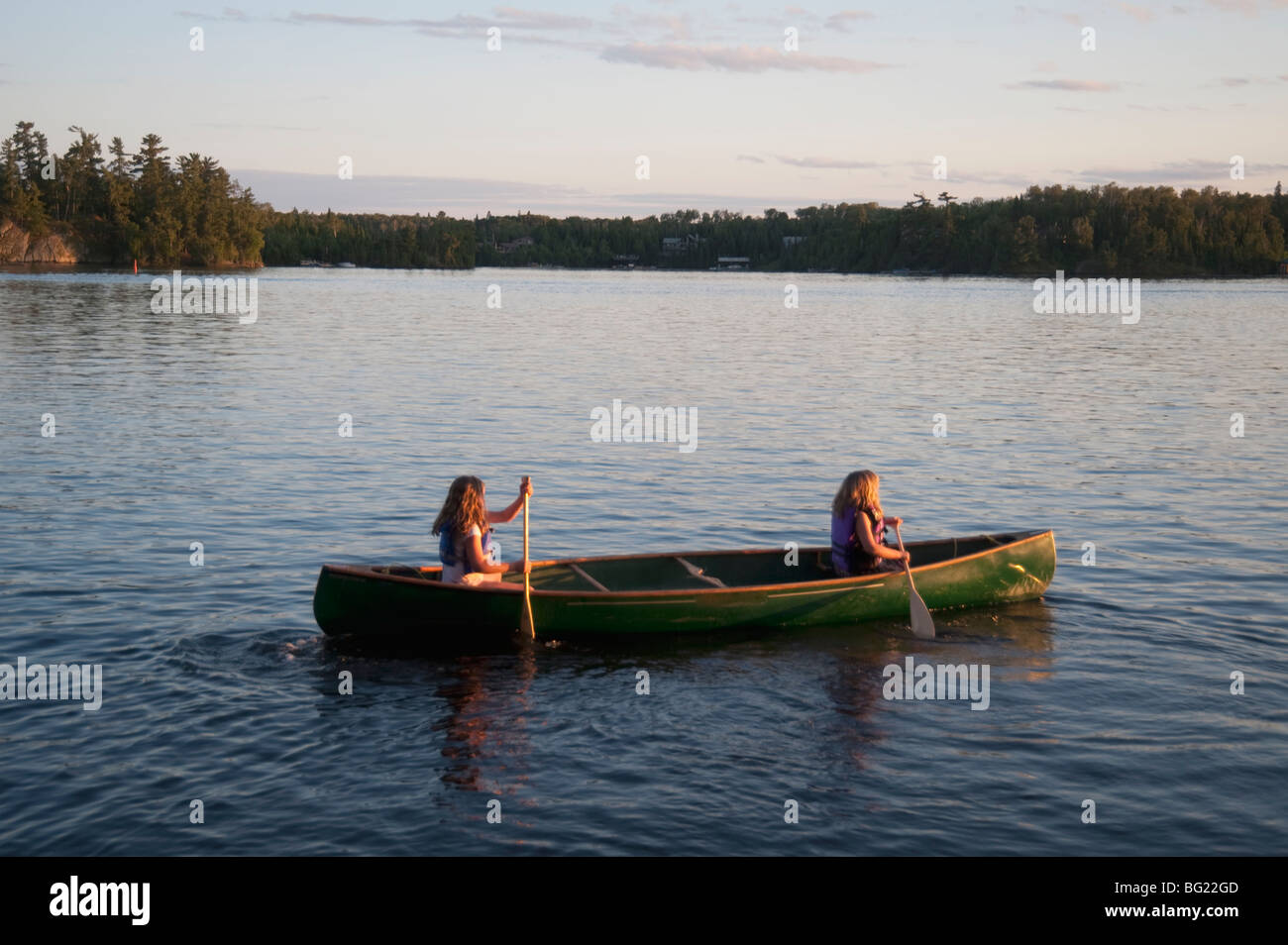 Two people in a canoe, Lake of the Woods, Ontario, Canada Stock Photo ...