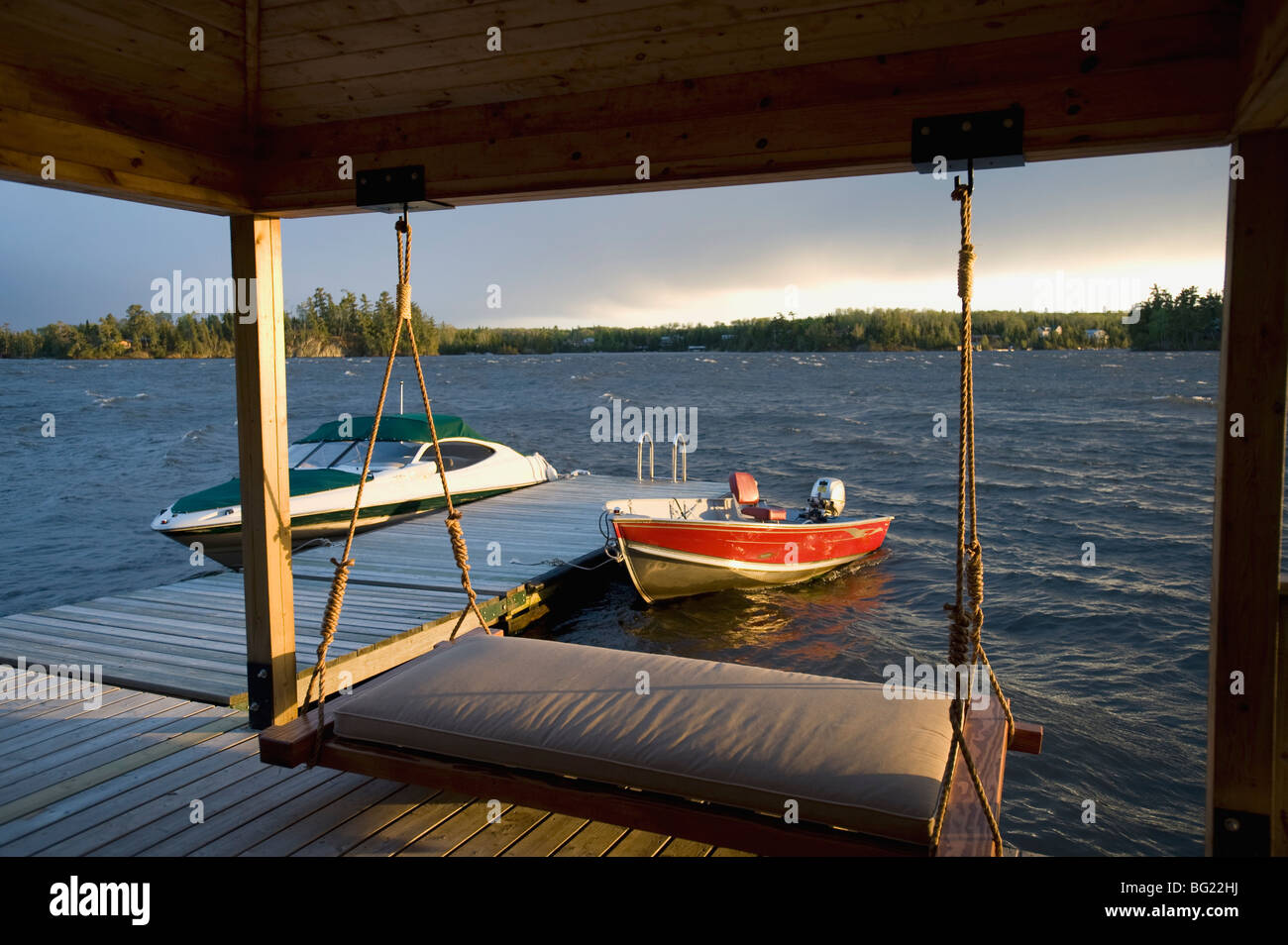 Boats tied to a dock Stock Photo - Alamy