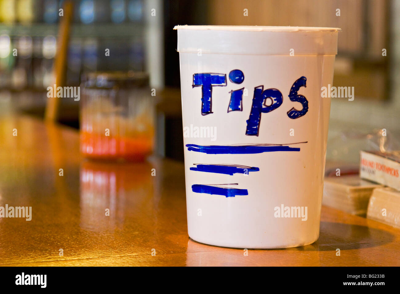 A tip jar on a bar in East Tennessee Stock Photo - Alamy