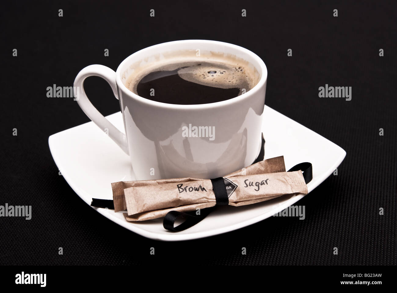 cup of black coffee with brown sugar portion Stock Photo - Alamy