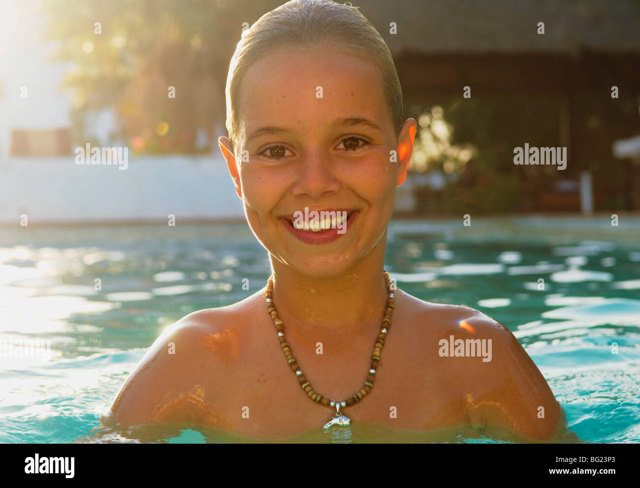 Girl in a swimming pool Stock Photo - Alamy
