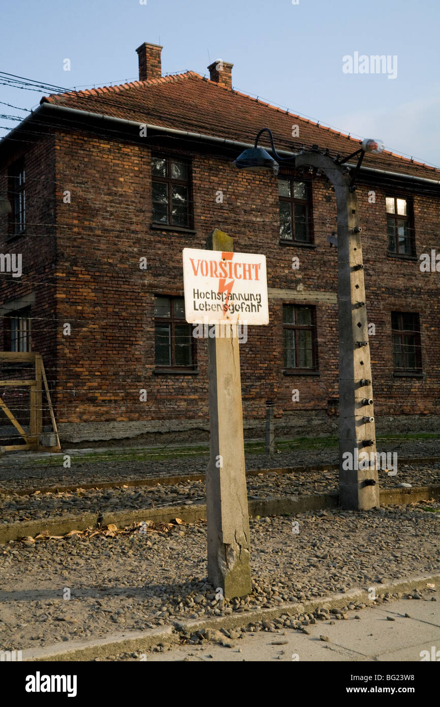 Perimeter electric fence & warning sign at Auschwitz Nazi death camp ...