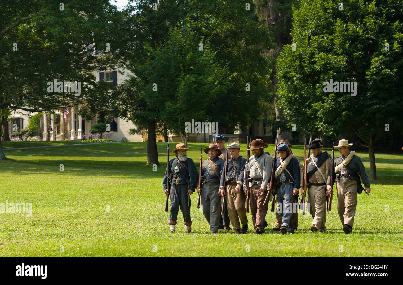 Confederate soldiers drill in the field in front of the Gambrill ...