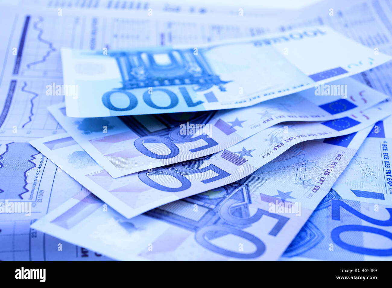 euro notes on a financial newspaper in blue tones. closeup. small GRIP ...