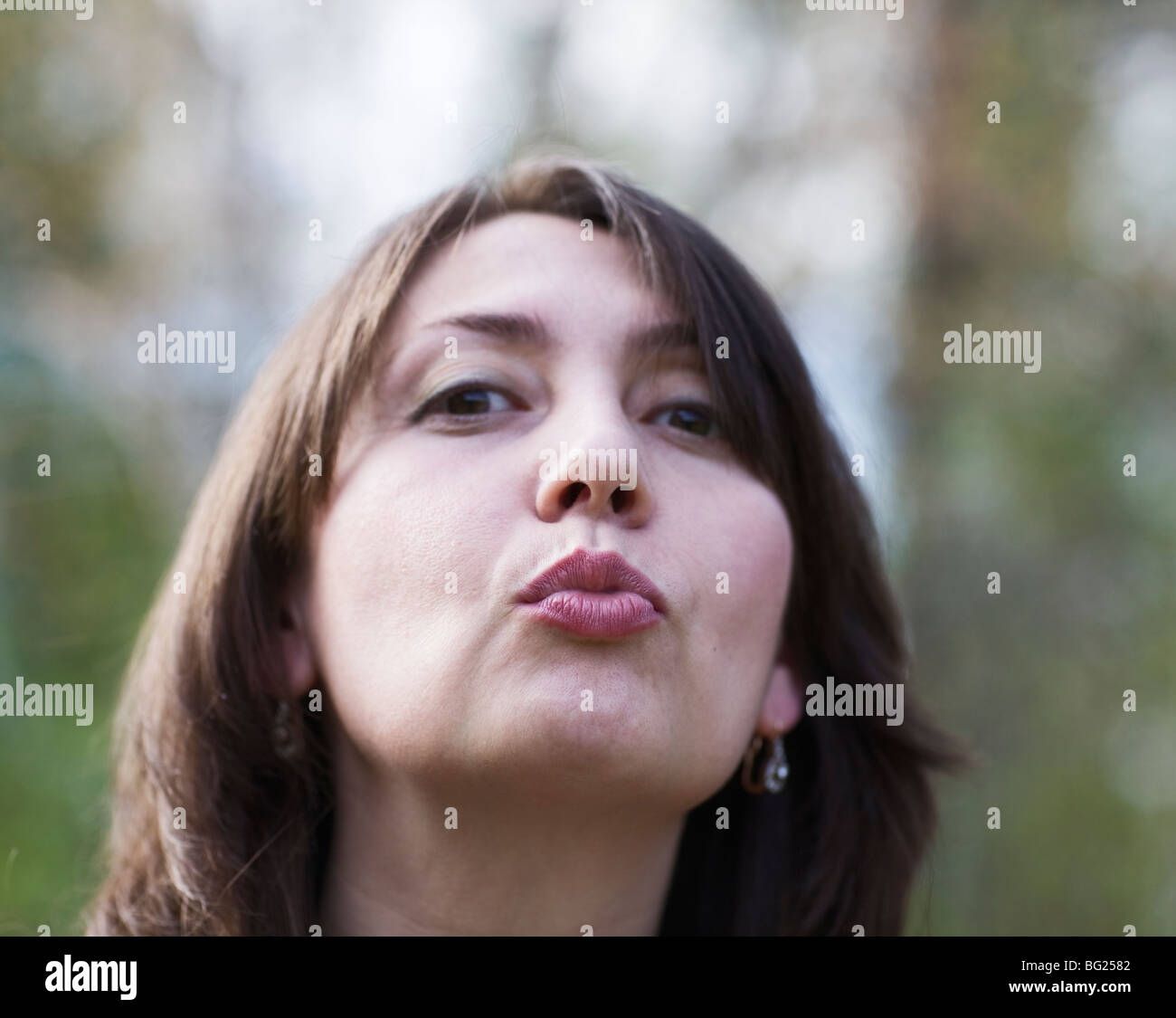 Mature woman giving a kiss Stock Photo - Alamy
