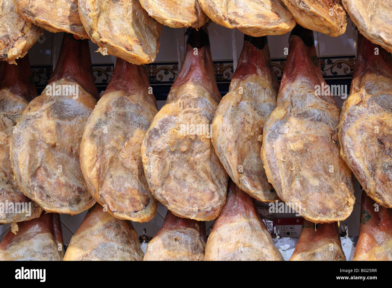 Hams hanging in supermarket hi-res stock photography and images - Alamy