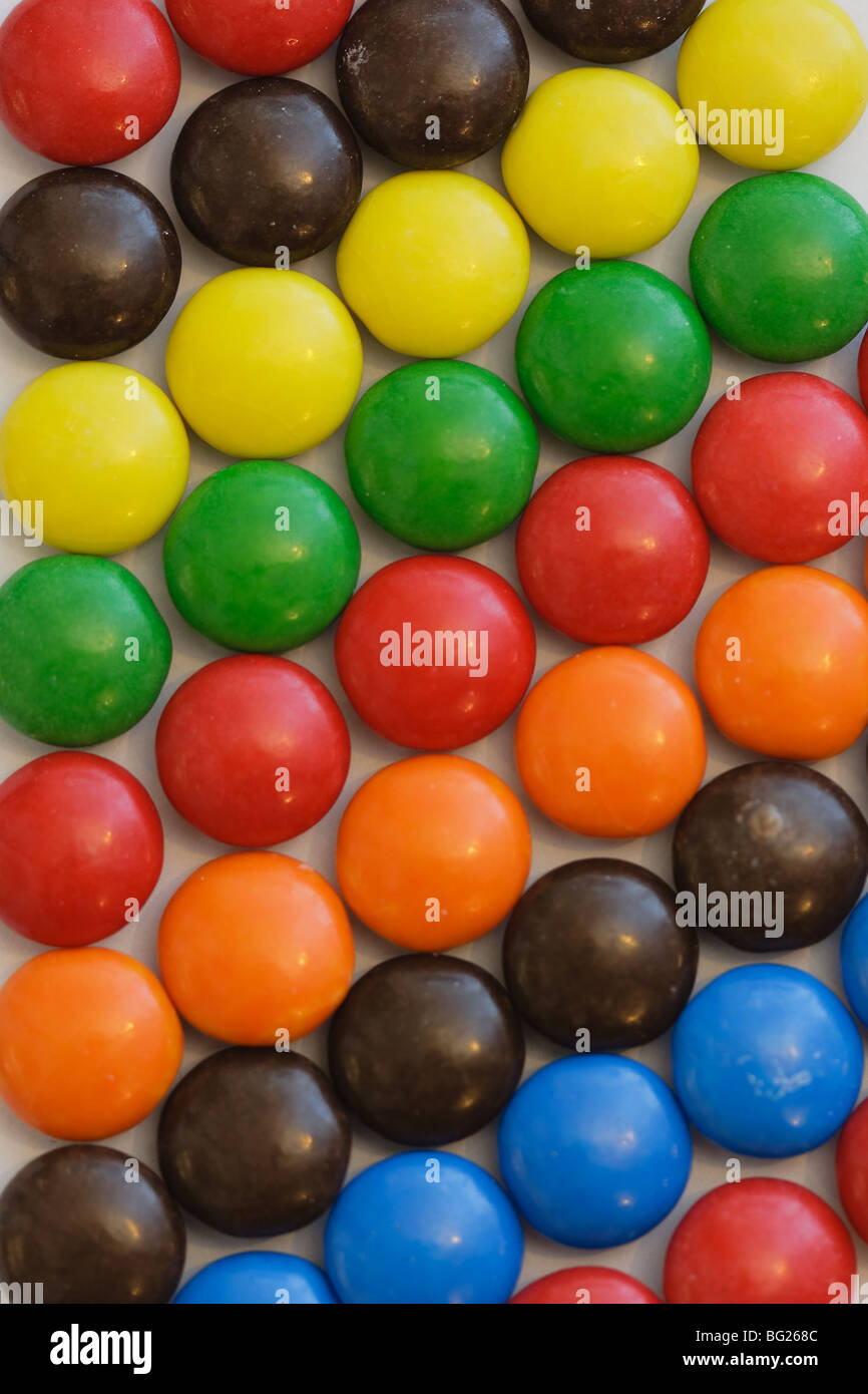 colorful candy in diagonal rows on white Stock Photo - Alamy