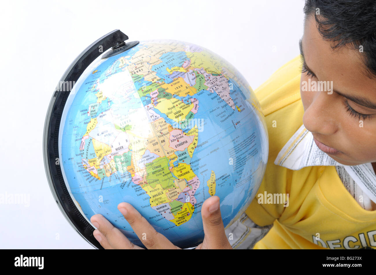 A young boy searching for a Country on the Globe Stock Photo - Alamy