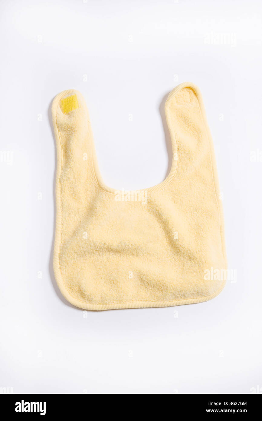 yellow baby bib Stock Photo - Alamy