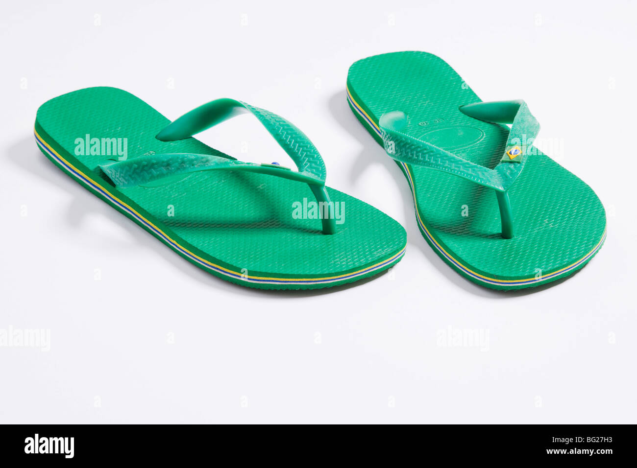 A pair of green flip flops Stock Photo - Alamy