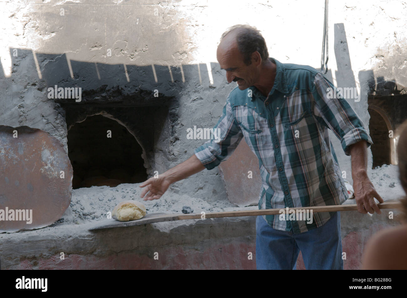 Greece. Zakynthos. Zante. Greek island. October. Bread being baked by a ...