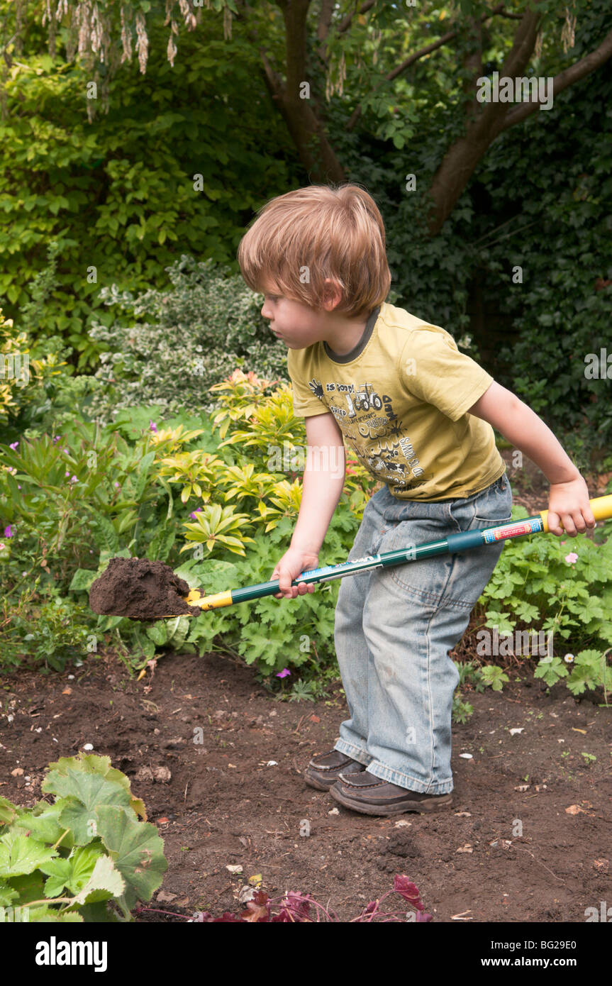 Child digging dirt hi-res stock photography and images - Alamy