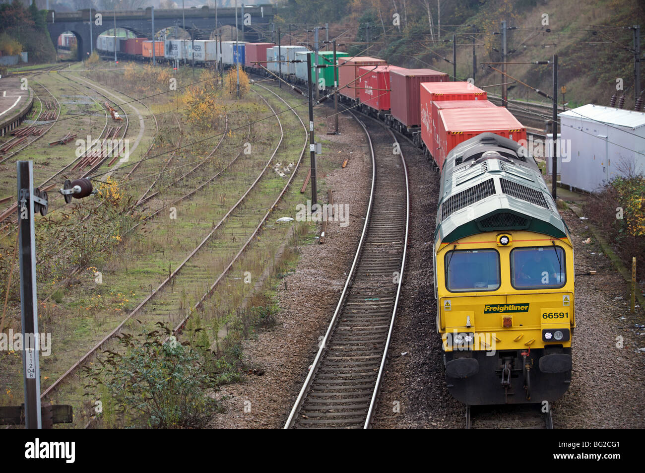 Freight train leaving the electrified main line to a branch line to the ...