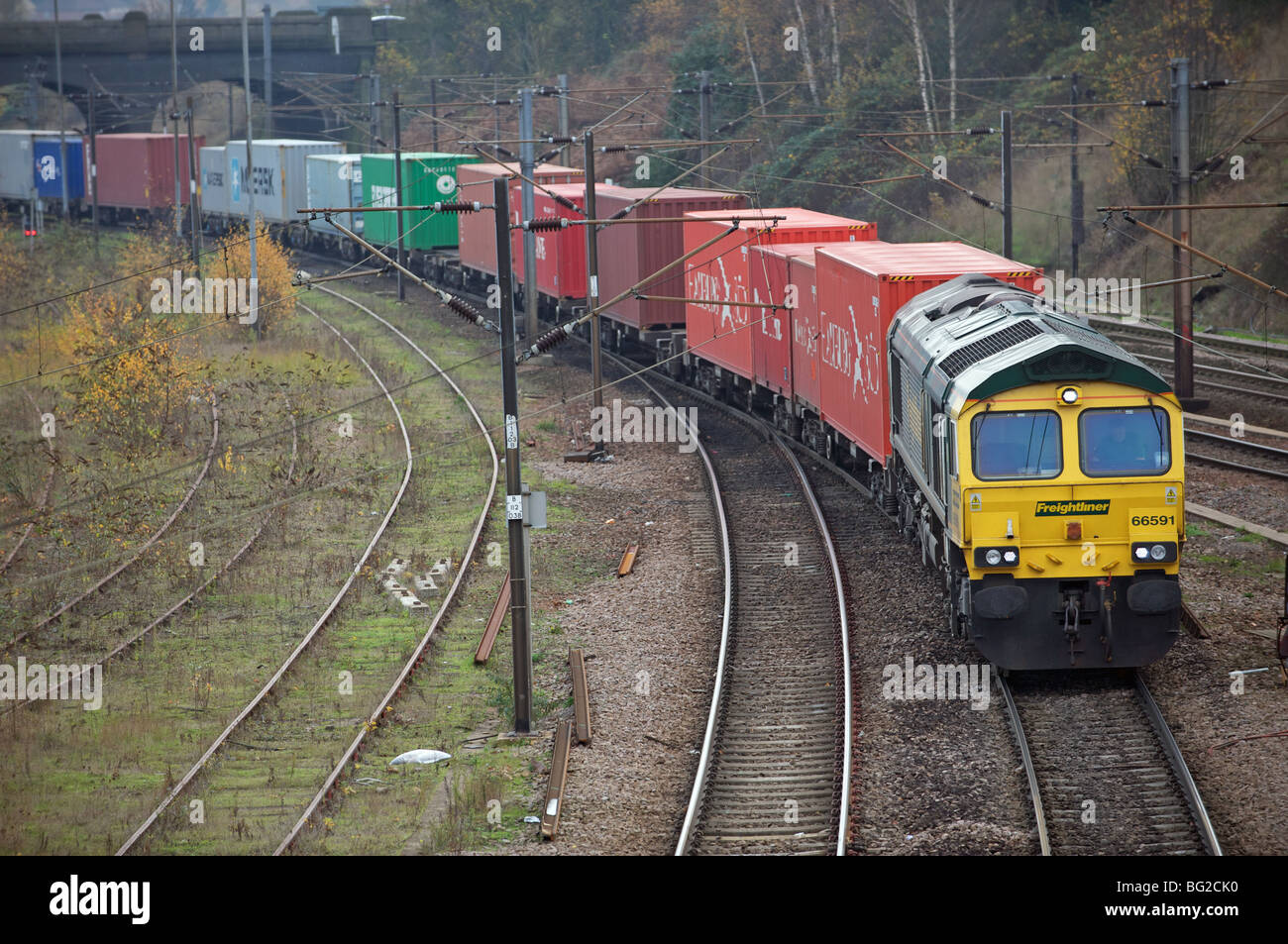 Freight train leaving the electrified main line to a branch line to the ...