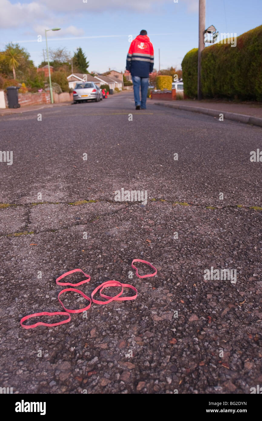 Postman dropping rubber bands hi-res stock photography and images - Alamy