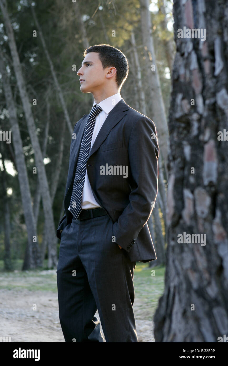 Businessman posing relaxed on a park forest outdoor landscape Stock ...