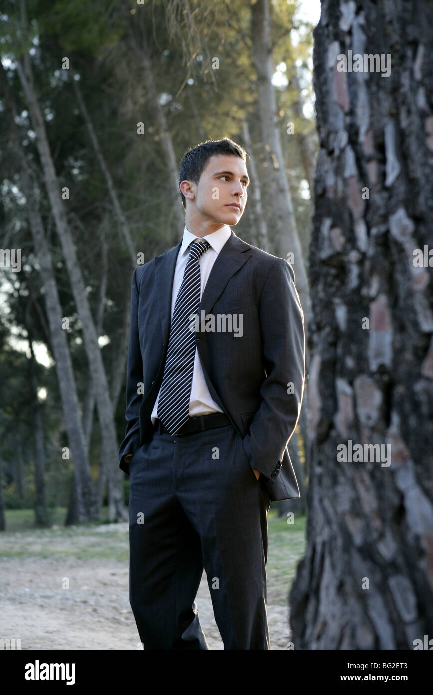 Businessman posing relaxed on a park forest outdoor landscape Stock ...