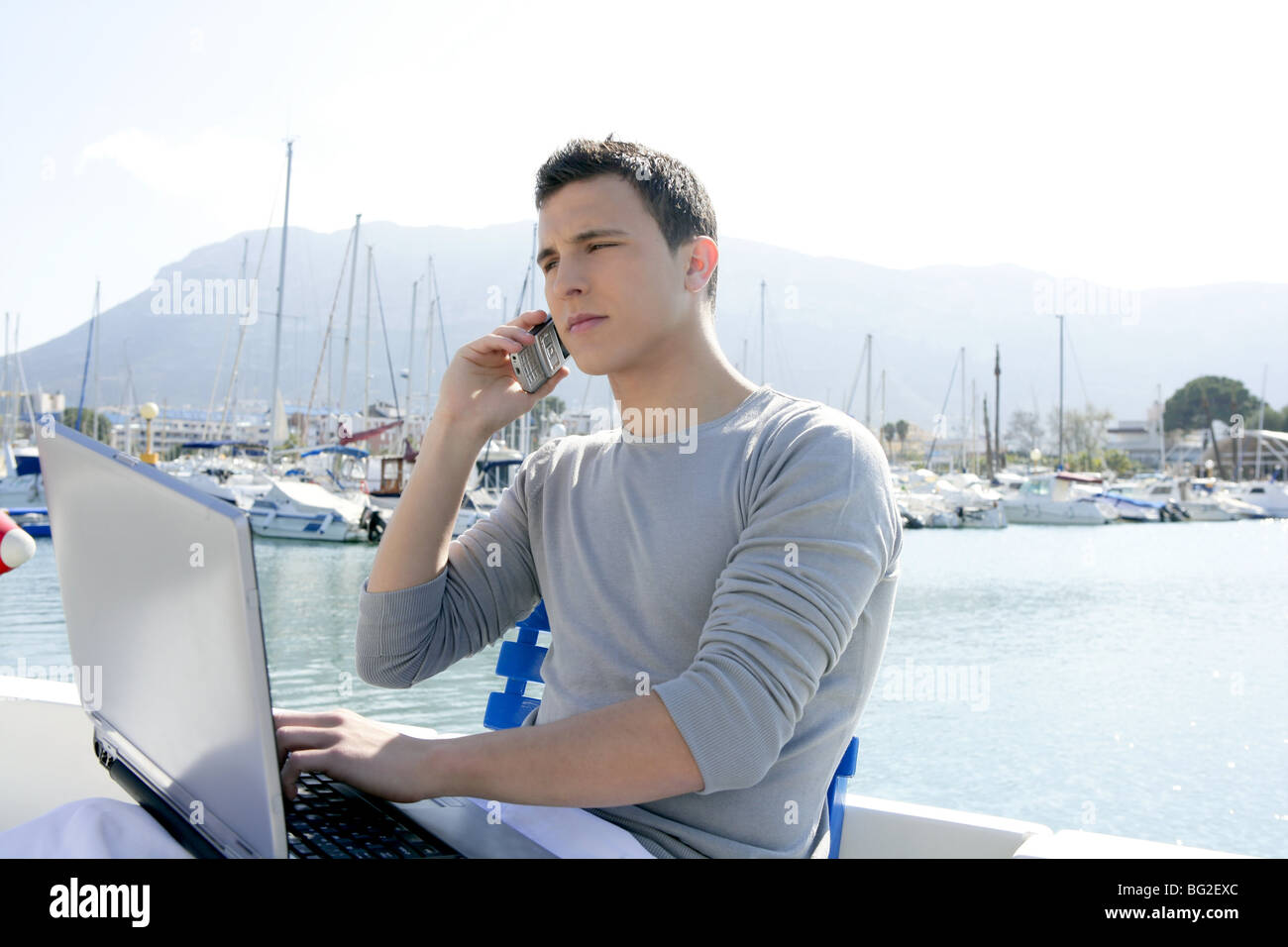Businessman working computer on boat hi-res stock photography and ...