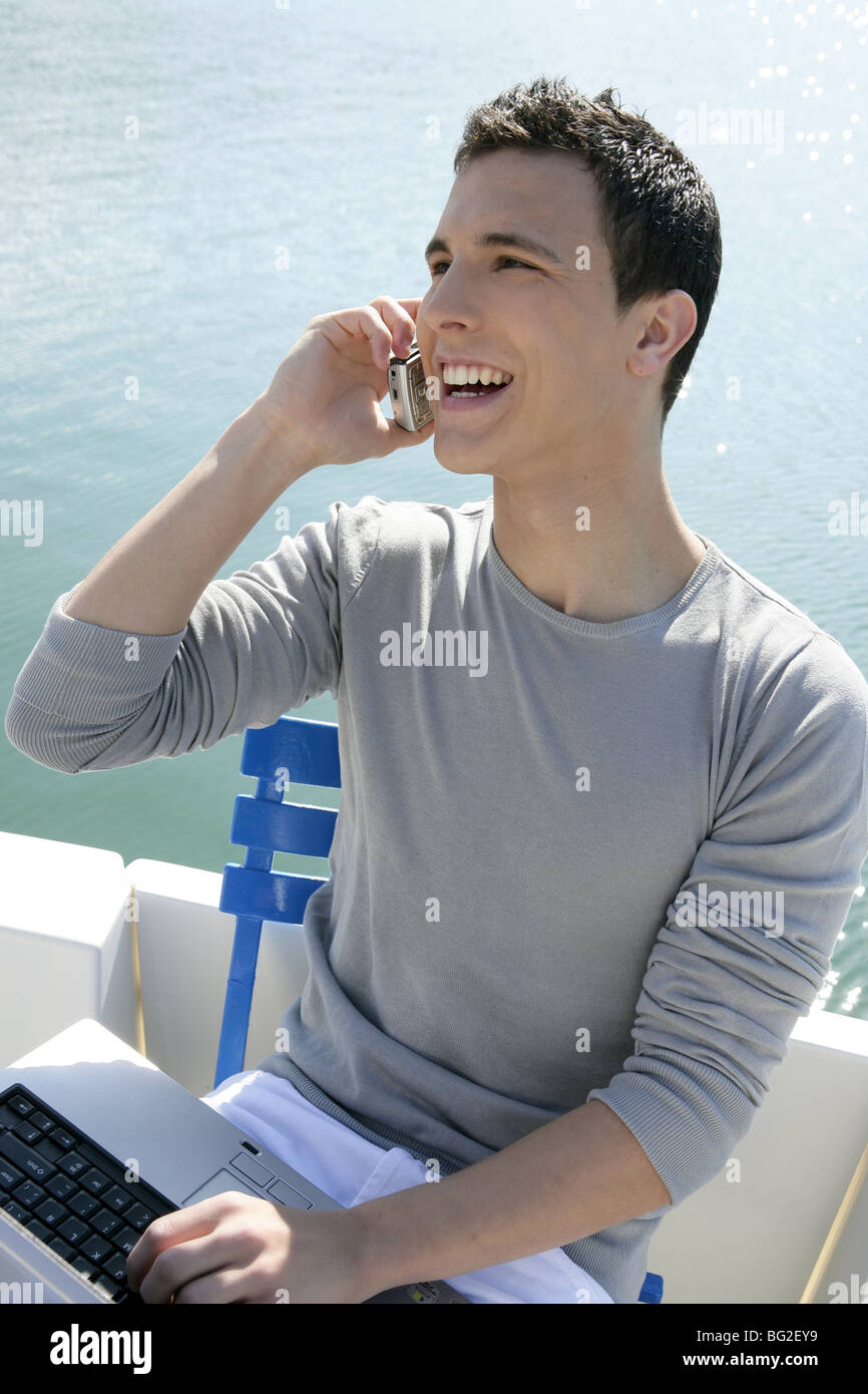 Businessman working computer on boat hi-res stock photography and ...