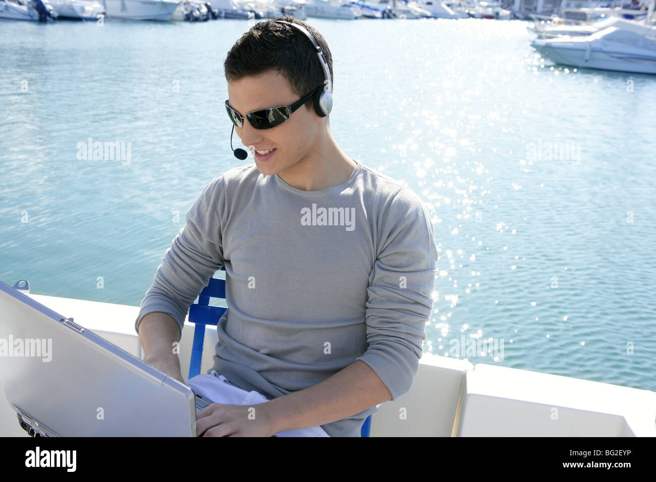 Businessman working computer on boat hi-res stock photography and ...
