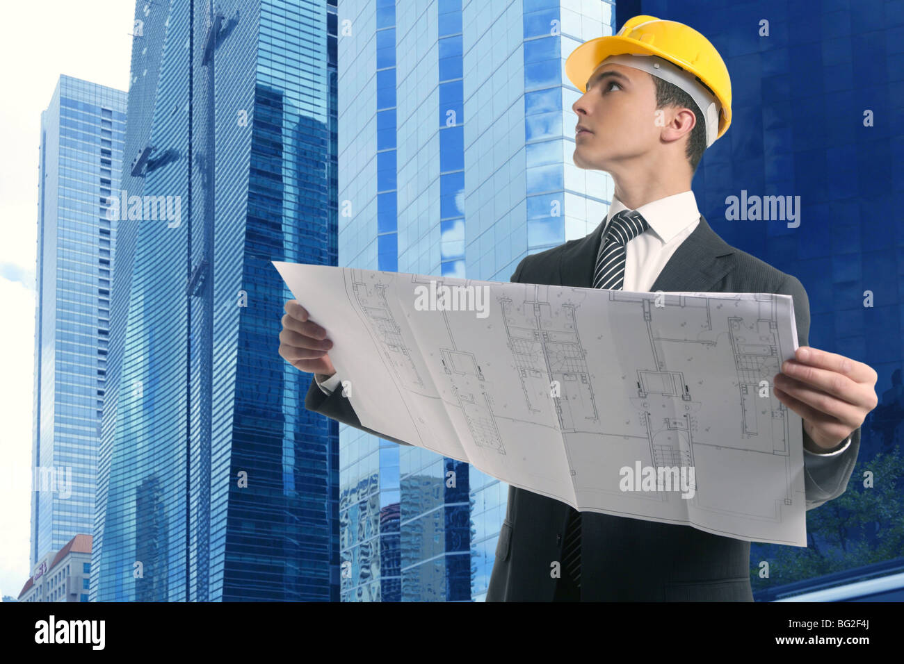 Architect executive businessman with plan and hard hat Stock Photo - Alamy