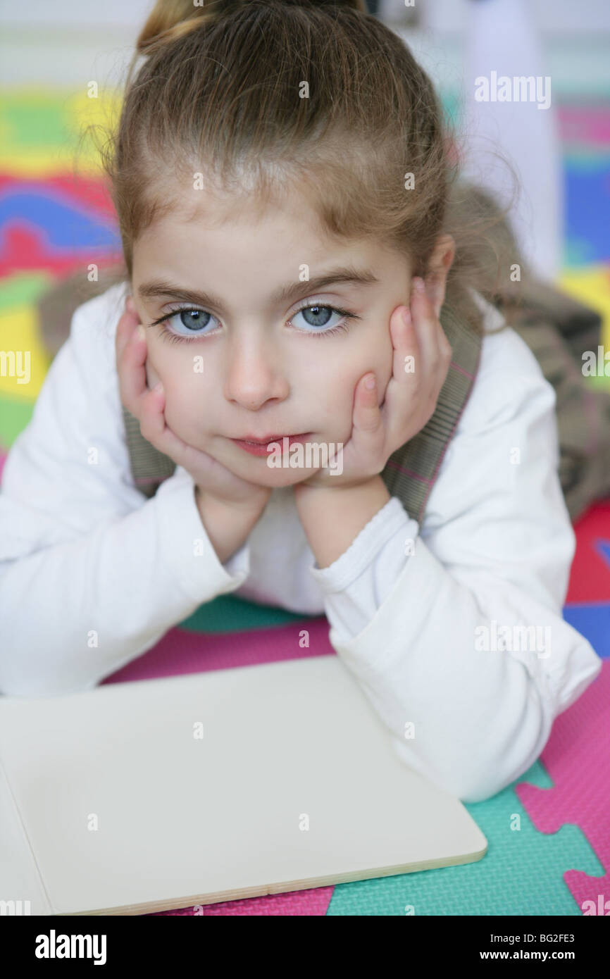 Beautiful preschooler little girl sutdent learning with homework book ...