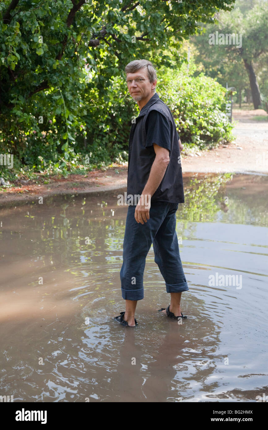 Mature Man standing in big Puddle - Cirali, Turkey, Asia Stock Photo ...