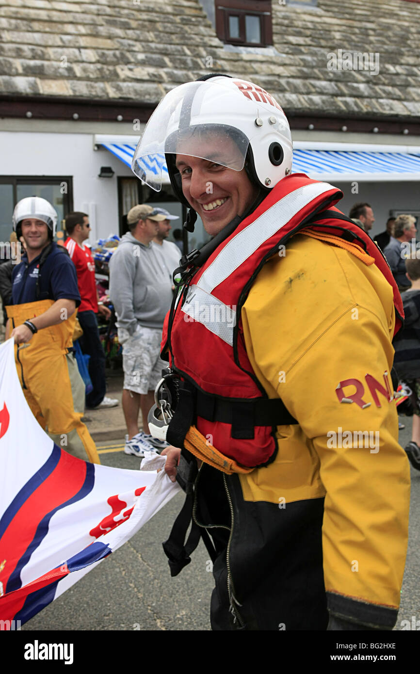 Member of the RNLI dressed in full wet weather and life preservation ...